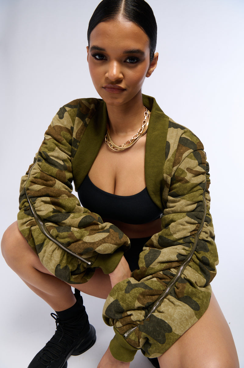 HIGH EXPECTATIONS RUCHED BOLERO – AKIRA